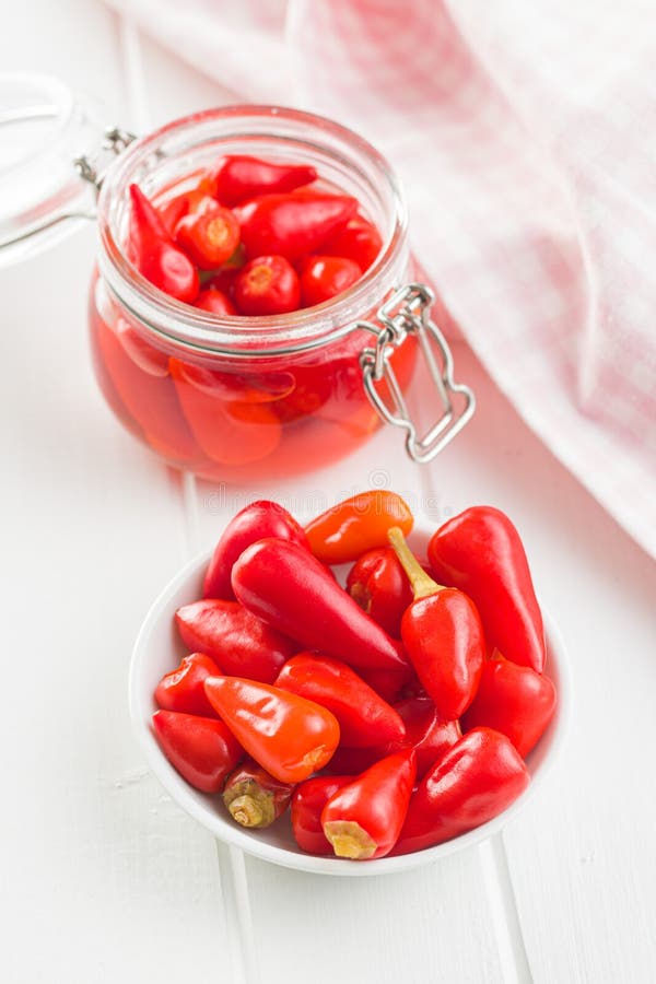 Pickled chili peppers stock image. Image of pickled - 149655771