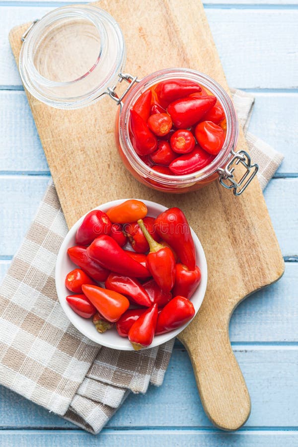 Pickled chili peppers stock image. Image of heat, cooking - 149655783
