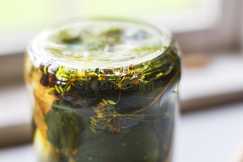 Pickled Cucumbers in a Glass Jar. Inverted Jar with Cucumbers. Stock ...