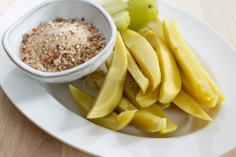 Pickled fermented mango. stock photo. Image of preserved - 77866754