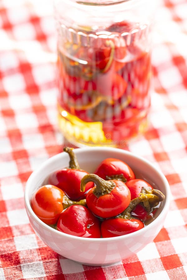 Pickled hot chili peppers. stock photo. Image of napkin - 114158862
