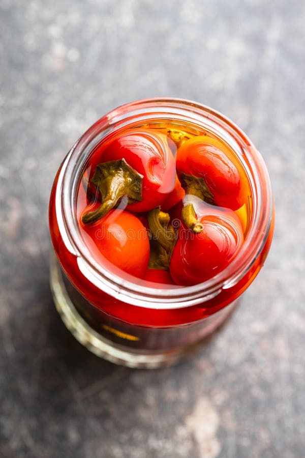 Pickled hot chili peppers. stock photo. Image of detail - 114158788