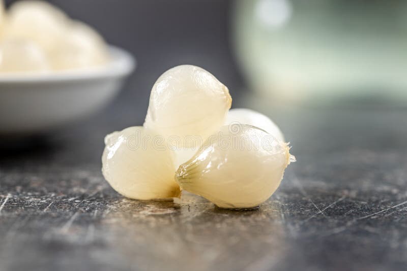 Pickled Mini Baby Onions on Black Kitchen Table Stock Photo - Image of ...