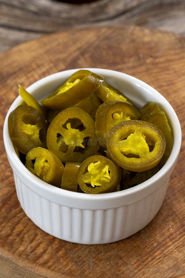 Pickled Sliced Green Jalapeno Peppers in White Bowl. Close Up Stock ... Pickled Sliced Green Jalapeno Peppers in White Bowl. Close Up Stock ...