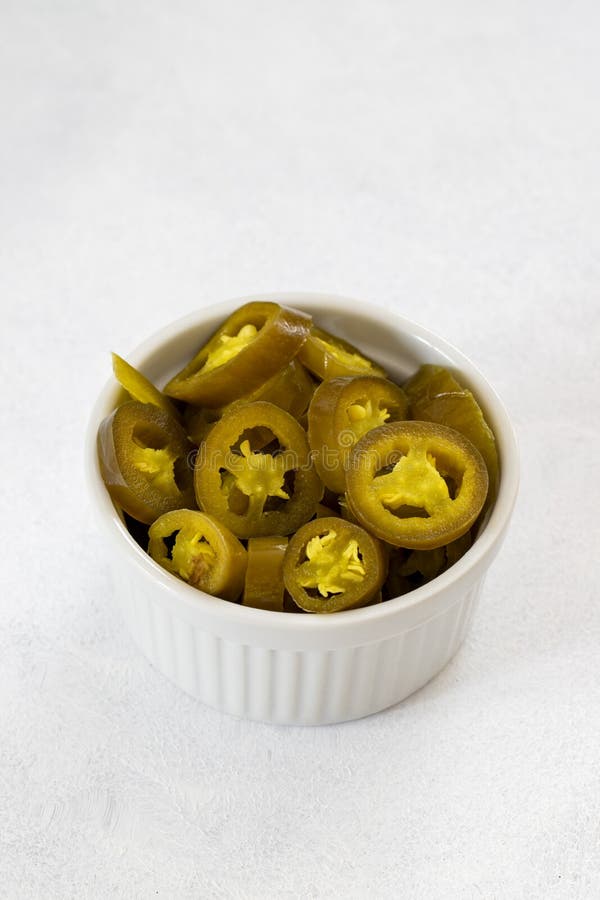 Pickled Sliced Green Jalapeno Peppers in White Bowl. Close Up Stock ... Pickled Sliced Green Jalapeno Peppers in White Bowl. Close Up Stock ...