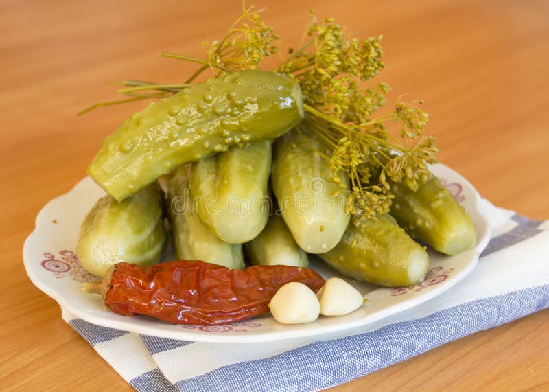 Pickles, Hot Pepper, Dill and Garlic on a Plate Stock Image - Image of ...