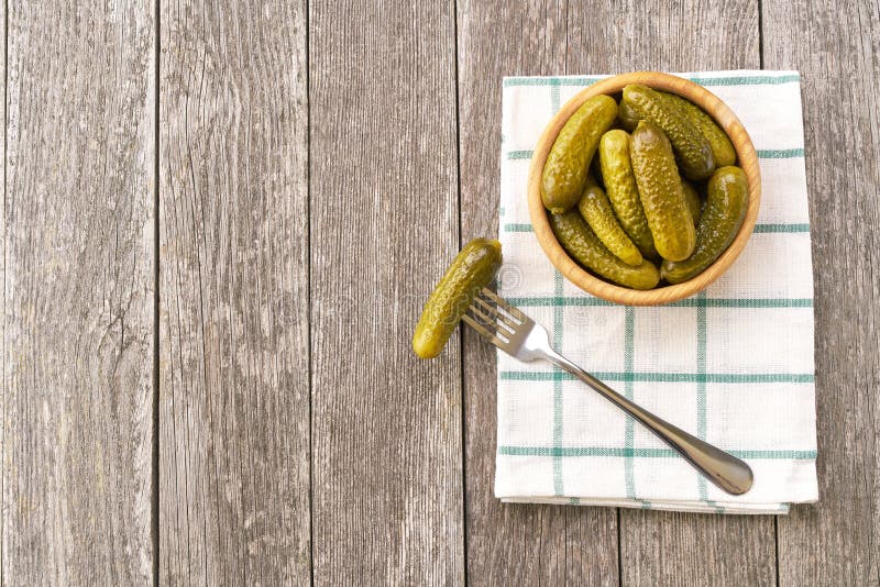 Pickles in a Wooden Bowl. Preserved Cucumbers in Bowl on a Wooden Table ...