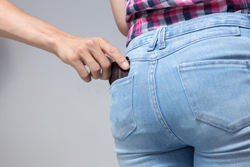 Pickpocketer`s Hand Pulling Stealing Wallet Out of the Back Pocket ...
