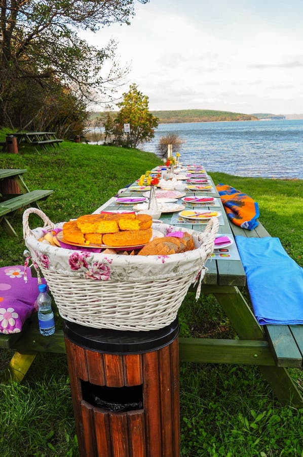 A Fancy Picnic Table Full of Food by Lake in Spring Stock Image - Image ...