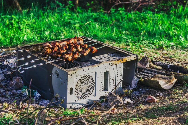 A Picnic with a Fire and a Grill in the Old Computer Case Stock Image ...