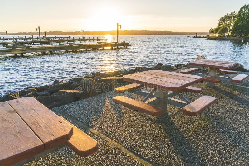 Picnic Table at Pier when Sunset. Stock Photo - Image of boat, bokeh ...