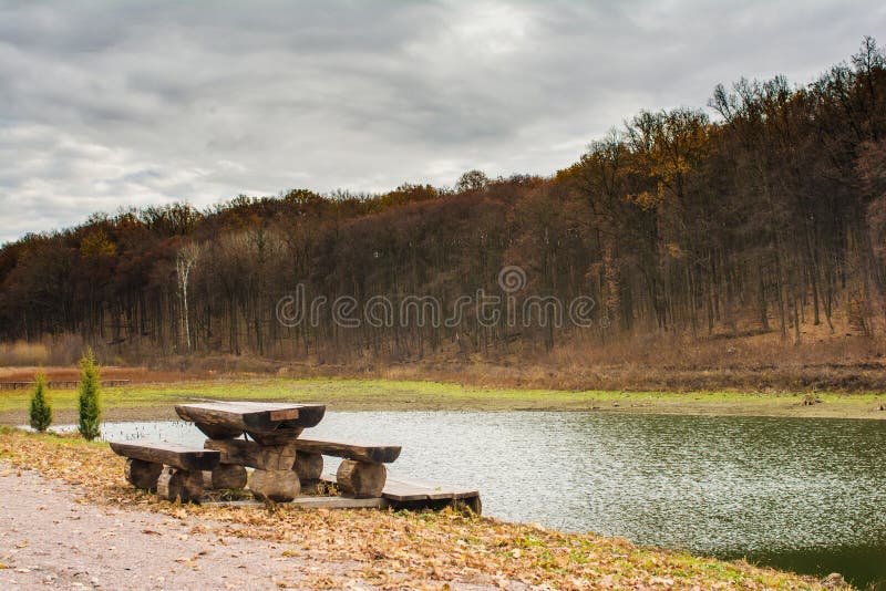 Picnic Table Near Lake in Autumn Forest Stock Photo - Image of foliage ...