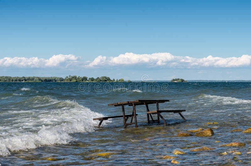 Picnic table in water stock photo. Image of island, smcoe - 75663398