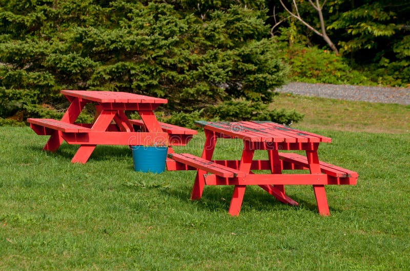 Two red picnic tables stock image. Image of summer, road - 30278977