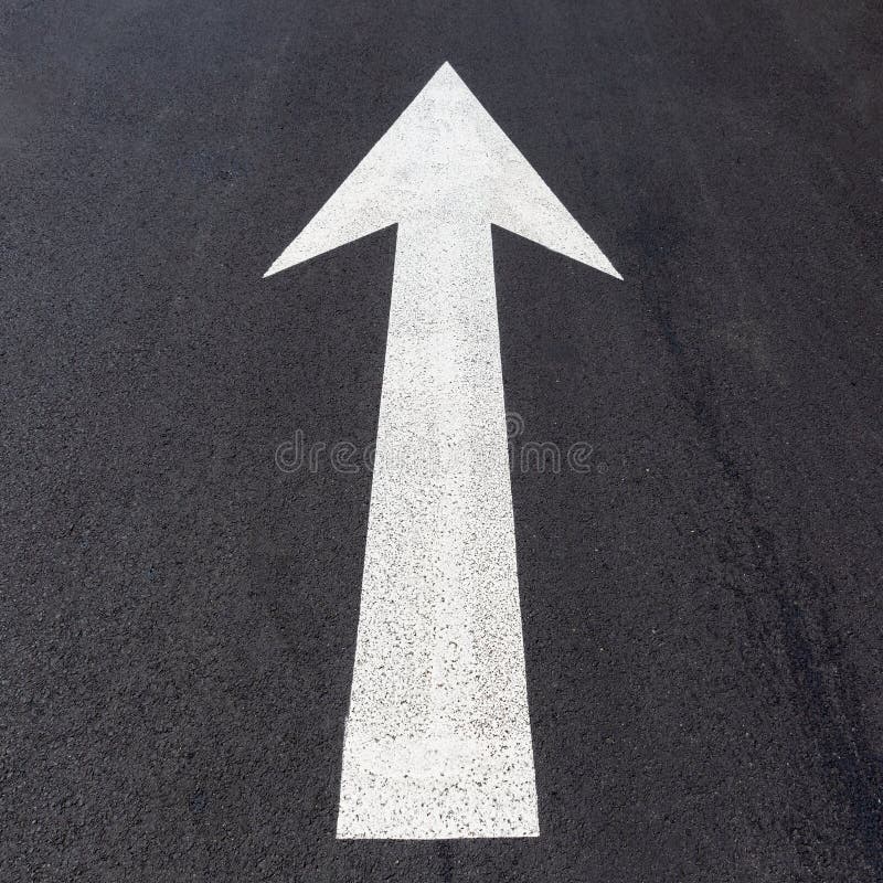 Arrow sign on a road stock photo. Image of asphalt, road - 168501932
