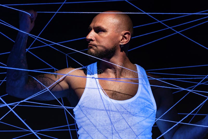 Picture of Tangled in Black Threads Fat Man on Red Background Stock ...