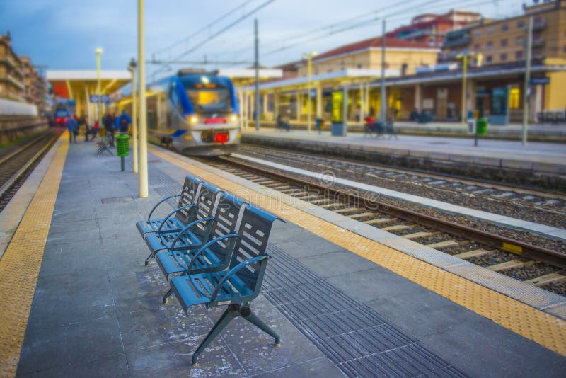 Picture of Bench on the Train Station with Blurred Train Stock Photo ...