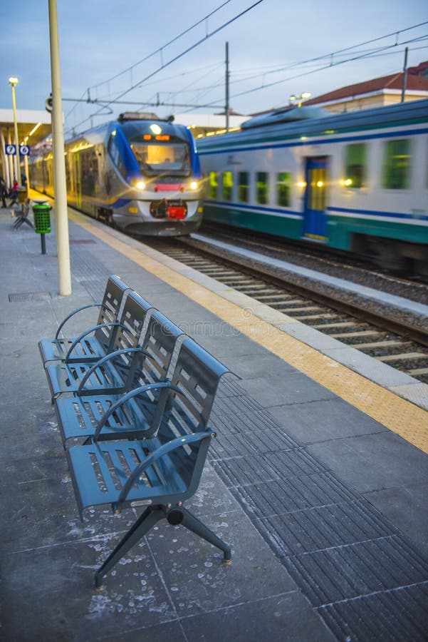 Picture of Bench on the Train Station with Blurred Train Stock Photo ...