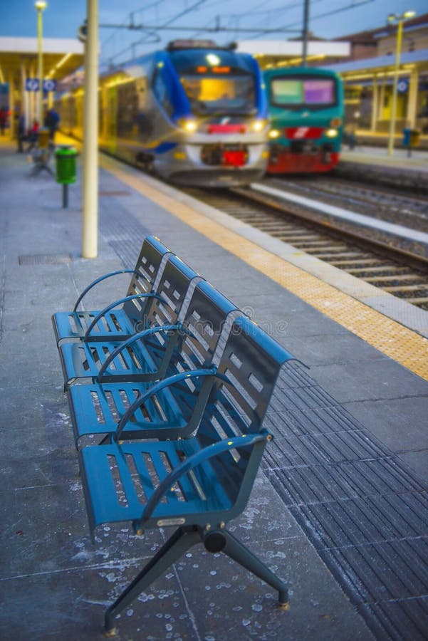 Picture of Bench on the Train Station with Blurred Train Stock Photo ...