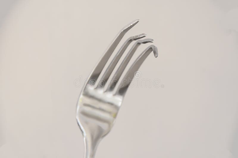 Bent dinner fork stock image. Image of gesture, isolated - 4882599