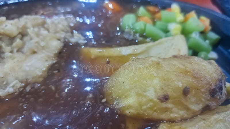 A Picture of Chicken Sticks with Vegetables and Potatoes Stock Photo ...