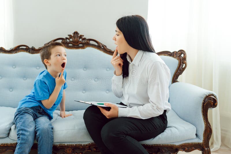 Picture of Child Psychologist Working with Young Boy in Office Stock ...
