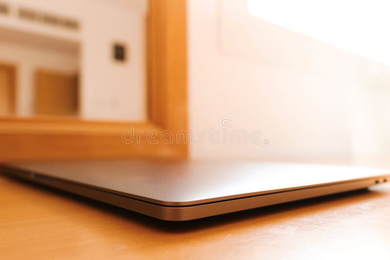 Picture of a Closed Laptop on a Wooden Surface Stock Image - Image of ...