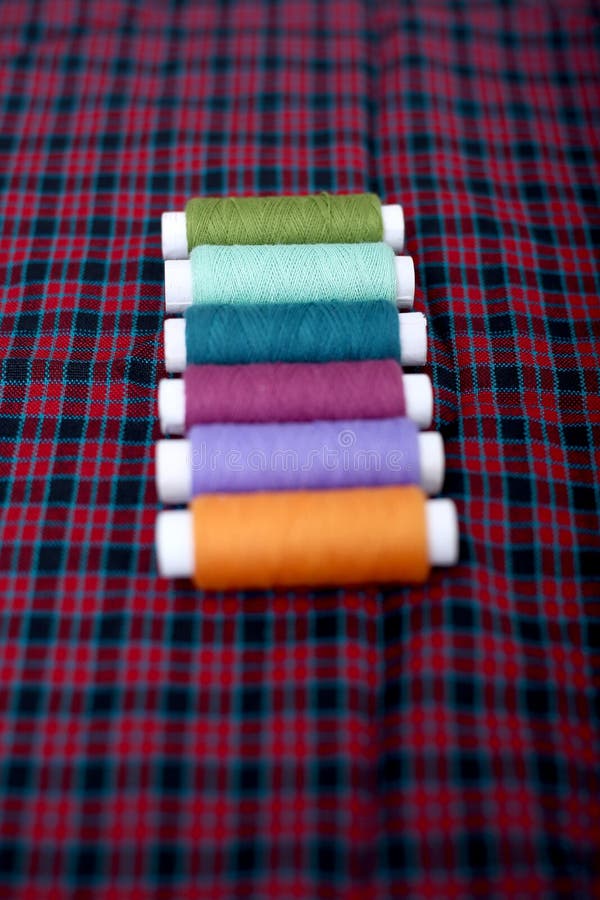 Picture of Colored Sewing Thread on the Cloth Stock Photo - Image of ...