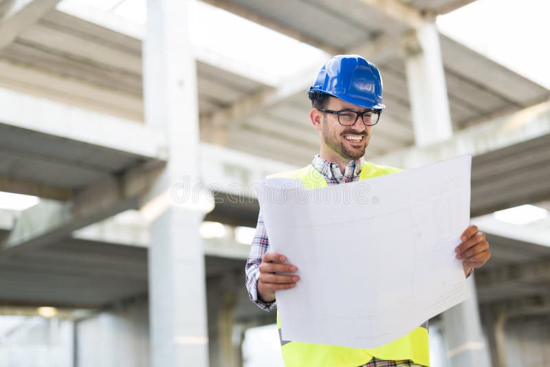 Picture of Construction Site Engineer Looking at Plan Stock Photo ...