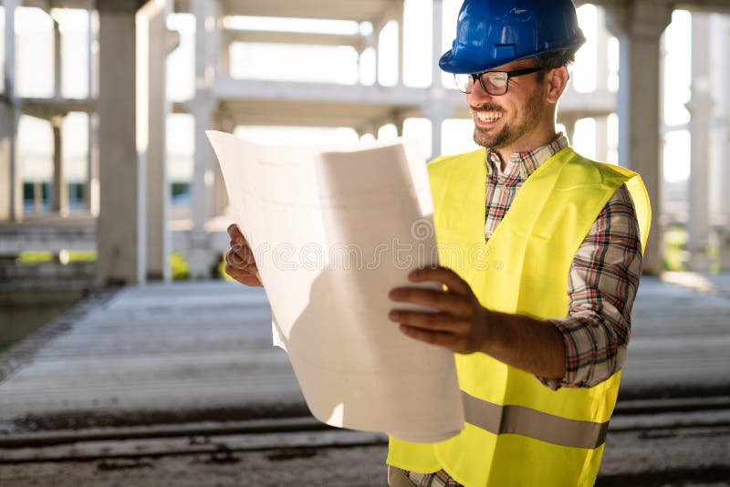 Picture of Construction Site Engineer Looking at Plan Stock Photo ...