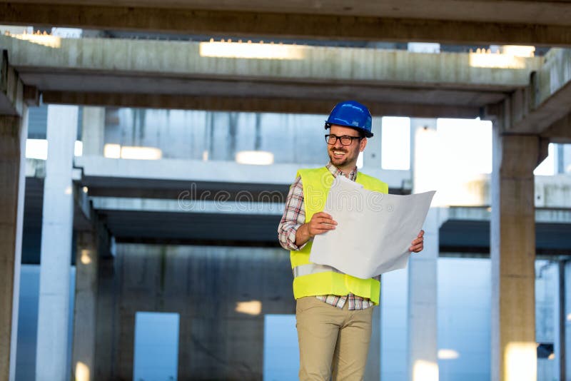 Picture of Construction Site Engineer Looking at Plan Stock Photo ...