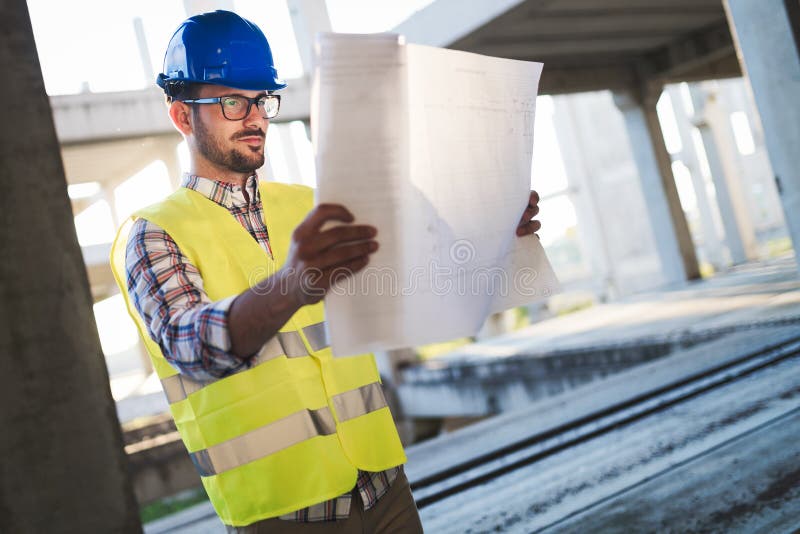 Picture of Construction Site Engineer Looking at Plan Stock Image ...