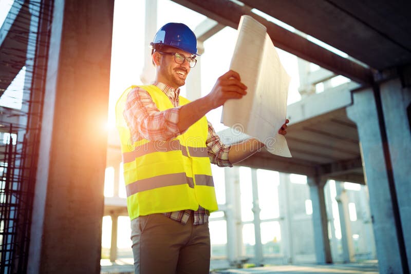 Picture of Construction Site Engineer Looking at Plan Stock Photo ...