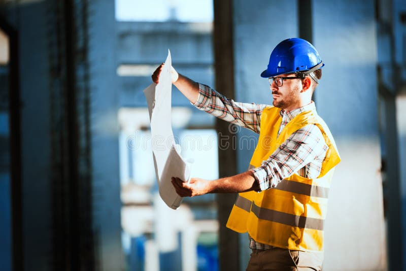 Picture of Construction Site Engineer Looking at Plan Stock Image ...