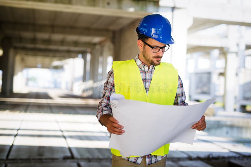 Picture of Construction Site Engineer Looking at Plan Stock Image ...