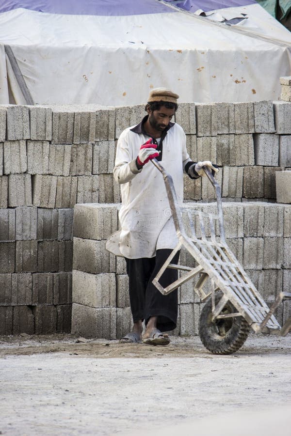 A Construction Worker Carrying Blocks Editorial Image - Image of ...