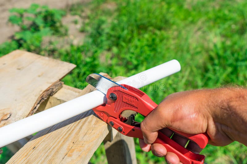 Picture of Cutting Plastic Pipe by Special Red Scissors Stock Image ...