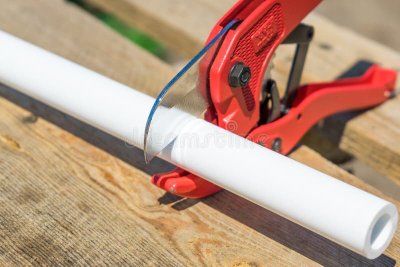 Picture of Cutting Plastic Pipe by Special Red Scissors Stock Photo ...