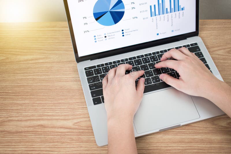 Picture of the Data Graph in a Laptop Computer on a Brown Wood Desk ...