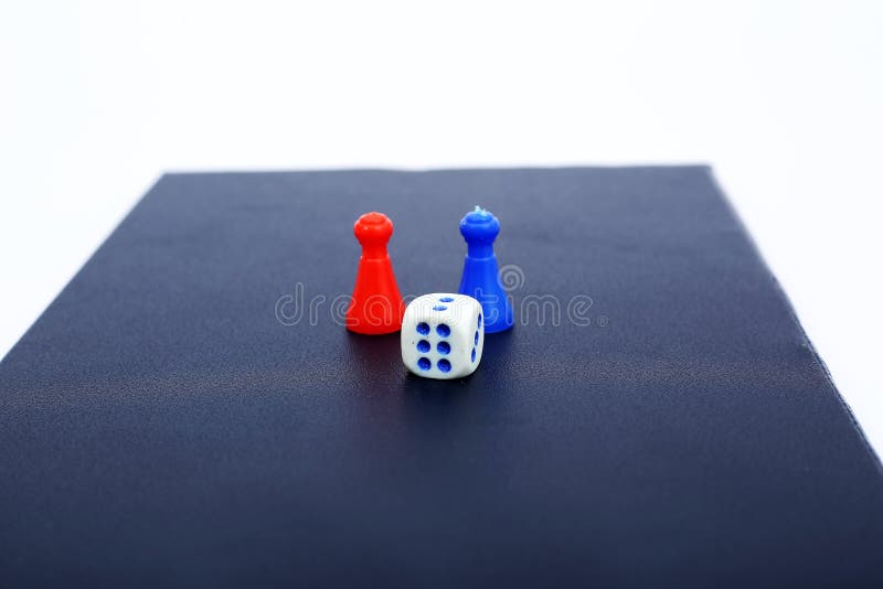 Picture of Dice and Different Colors Tokens on the Center Ludo Game ...