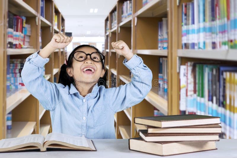 Elementary Student Celebrating Her Success in the Library Stock Image ...