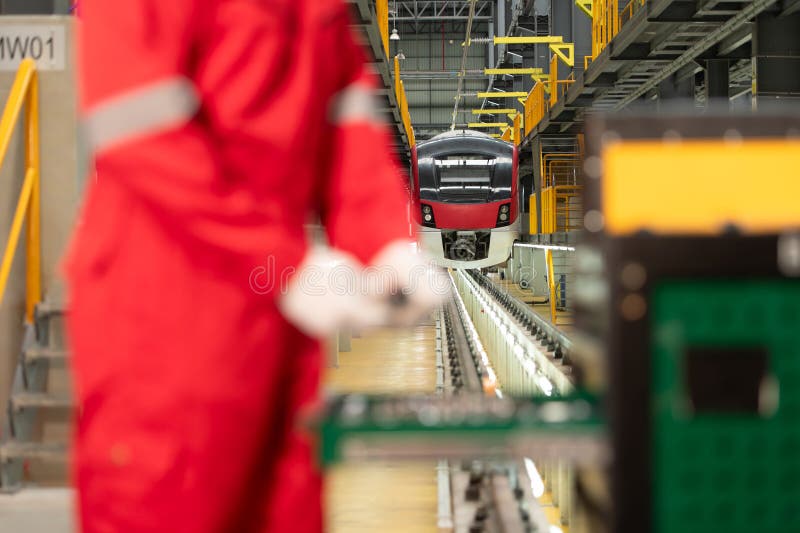 Picture of Engineer Using Repair Tools of the Electric Train Industry ...