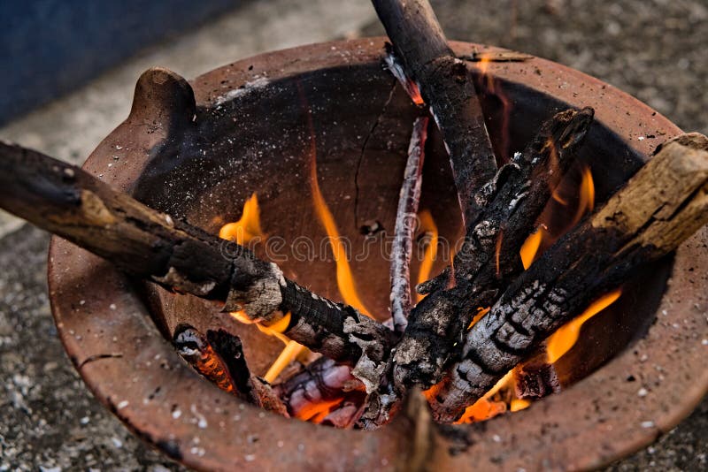 Picture of Fire Burning Wood into Ashes in a Clay Pot Stock Image ...