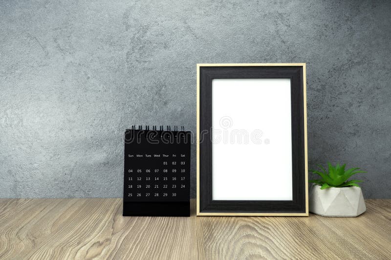 Picture Frame and Calendar on Table. Work Desk Space Stock Image ...