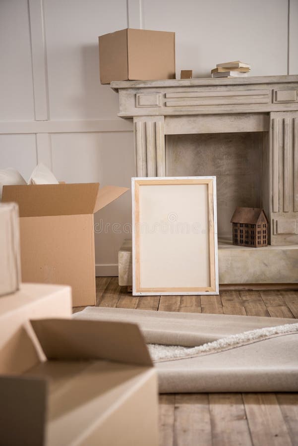 Picture Frame and Cardboard Boxes in Empty Room Stock Image - Image of ...