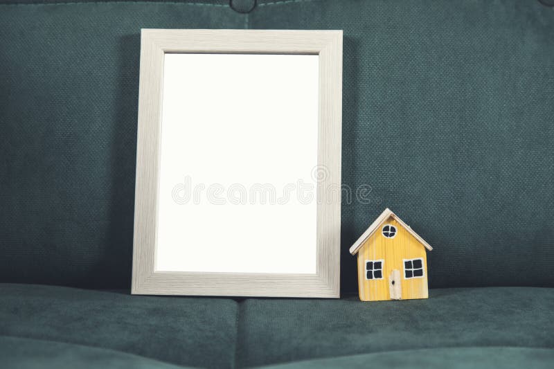 Picture Frame and House Model on the Sofa Stock Photo - Image of modern ...