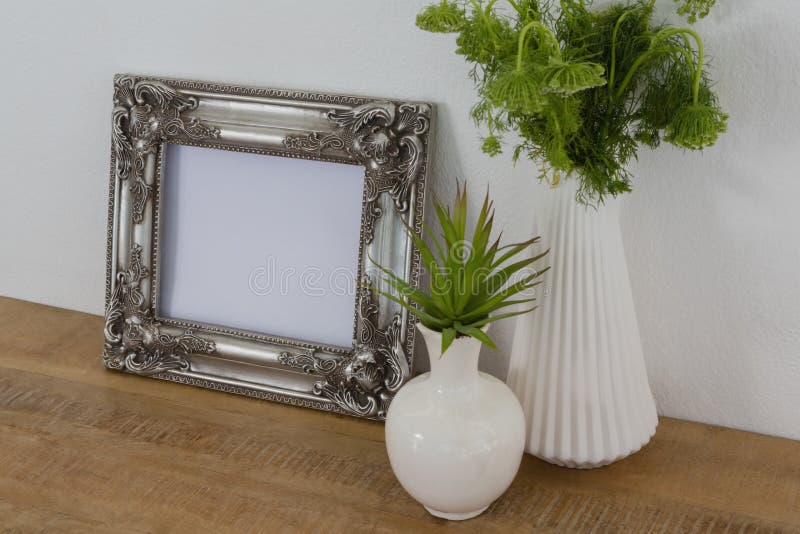 Picture Frame and Vase on Table Stock Image - Image of flora, memories ...