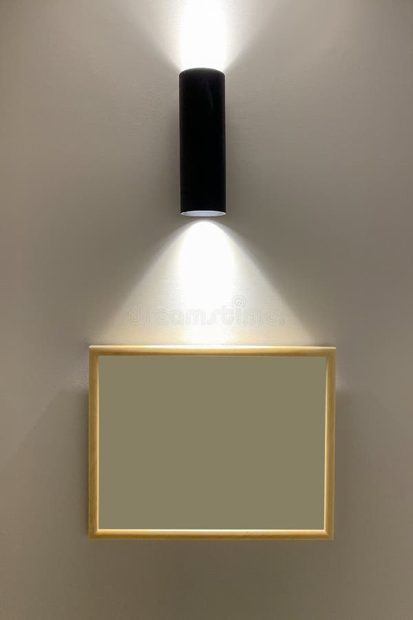 Picture Frame on the Wall Lit by a Lamp Stock Photo - Image of grunge ...