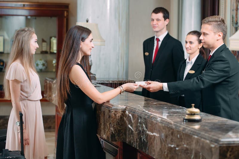 Picture of Guests Getting Key Card in Hotel. Stock Photo - Image of ...