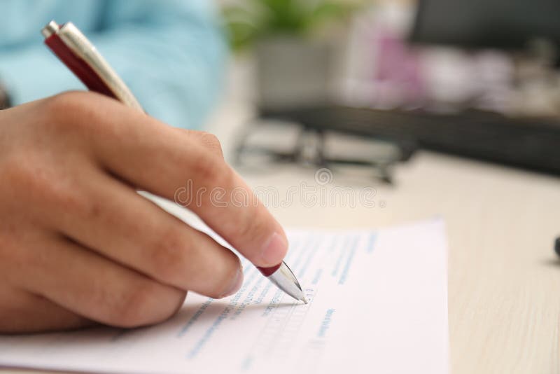 Picture of Hand is Filling Form with Pen Stock Photo - Image of flower ...